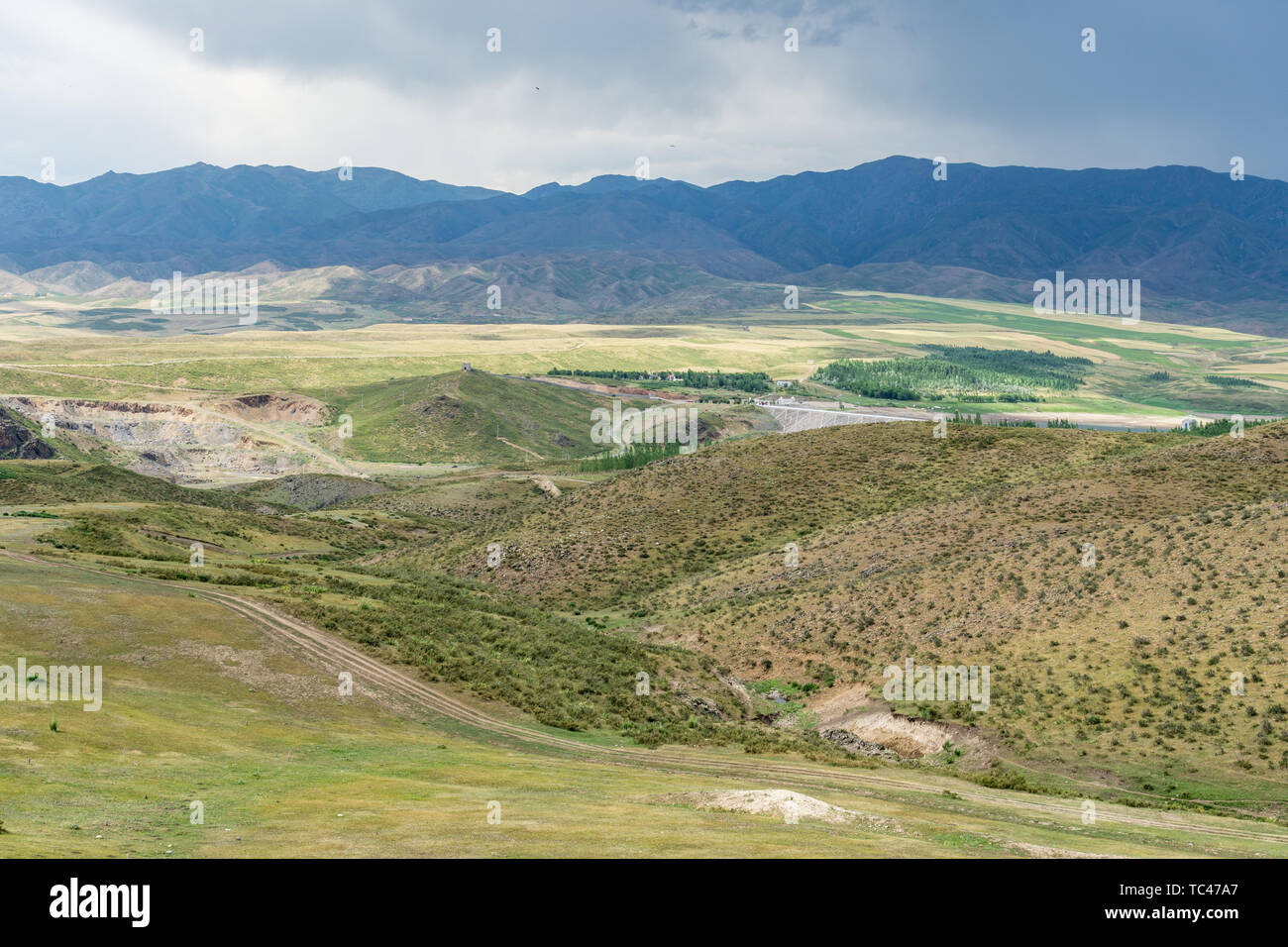 Hillside prairie villages under cloudy clouds Stock Photo - Alamy