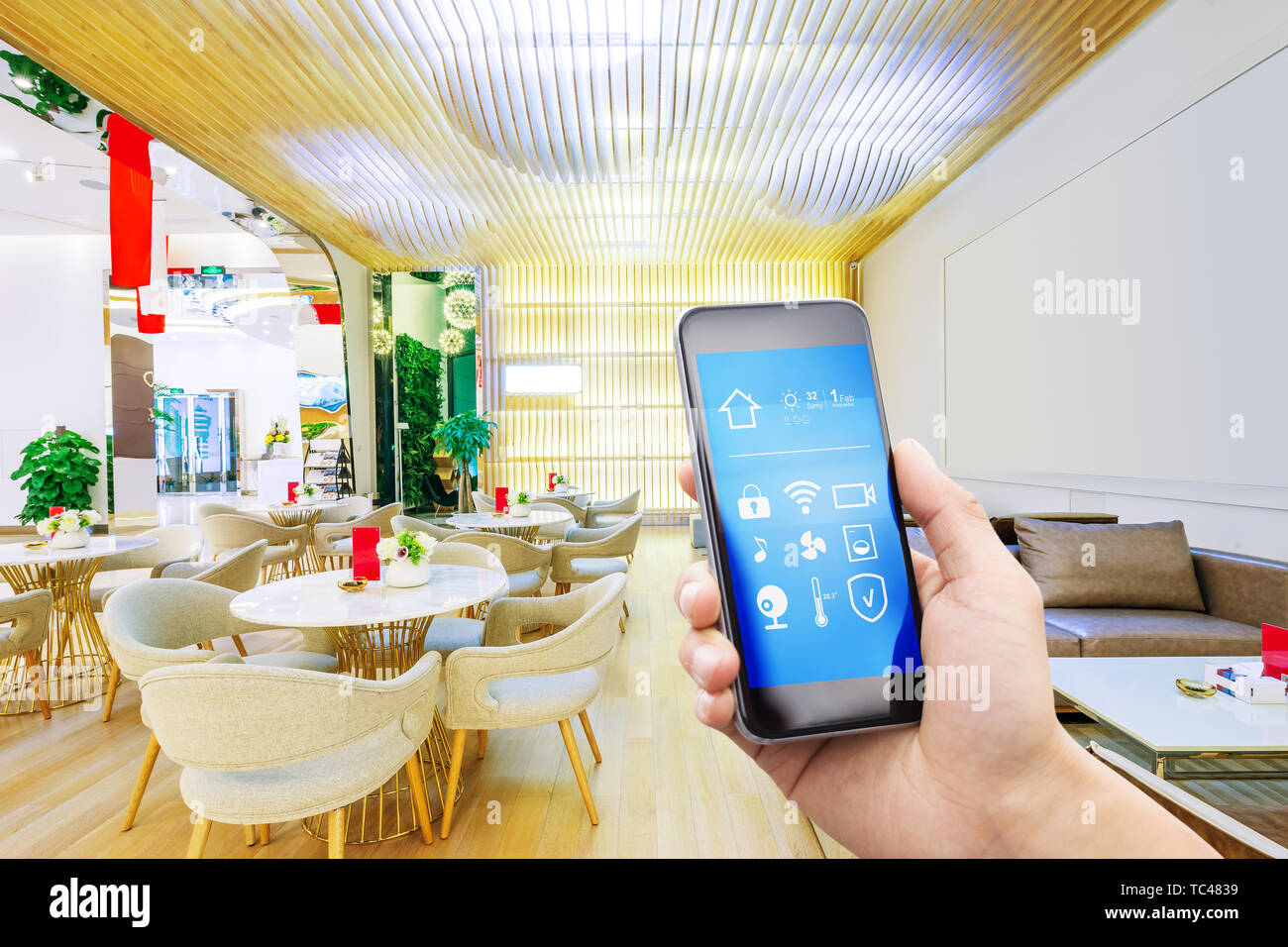 smart phone with smart home with modern dining room Stock Photo - Alamy