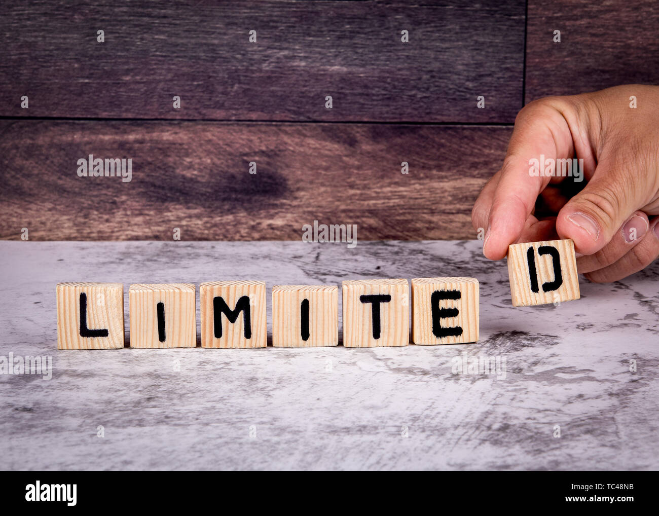 Limited. Word from wooden letters Stock Photo - Alamy