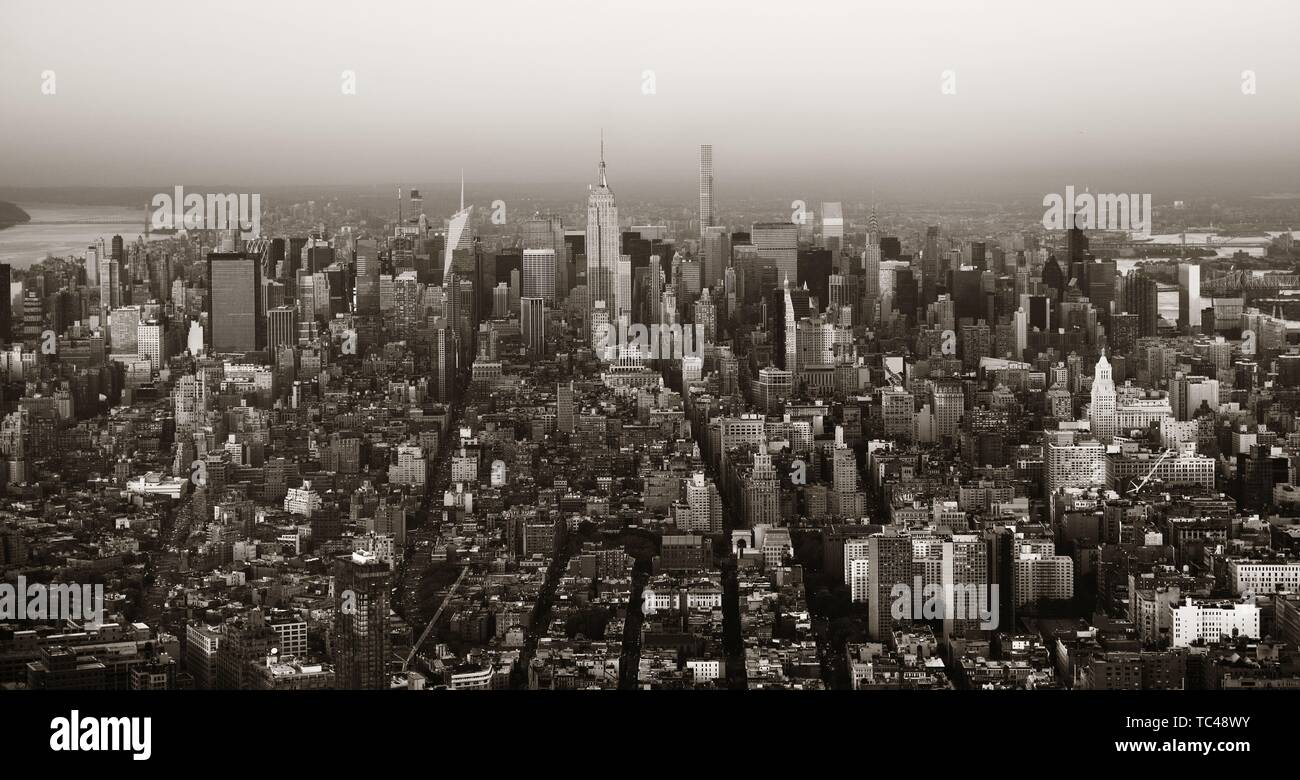 Manhattan midtown sunset rooftop view with urban skyscrapers in New ...