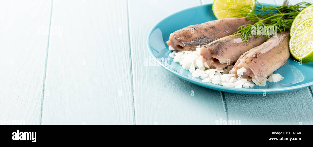 Traditional dutch food herring fish Stock Photo - Alamy