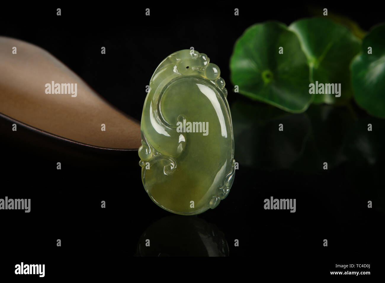 Jade safe and happy pendant Stock Photo - Alamy