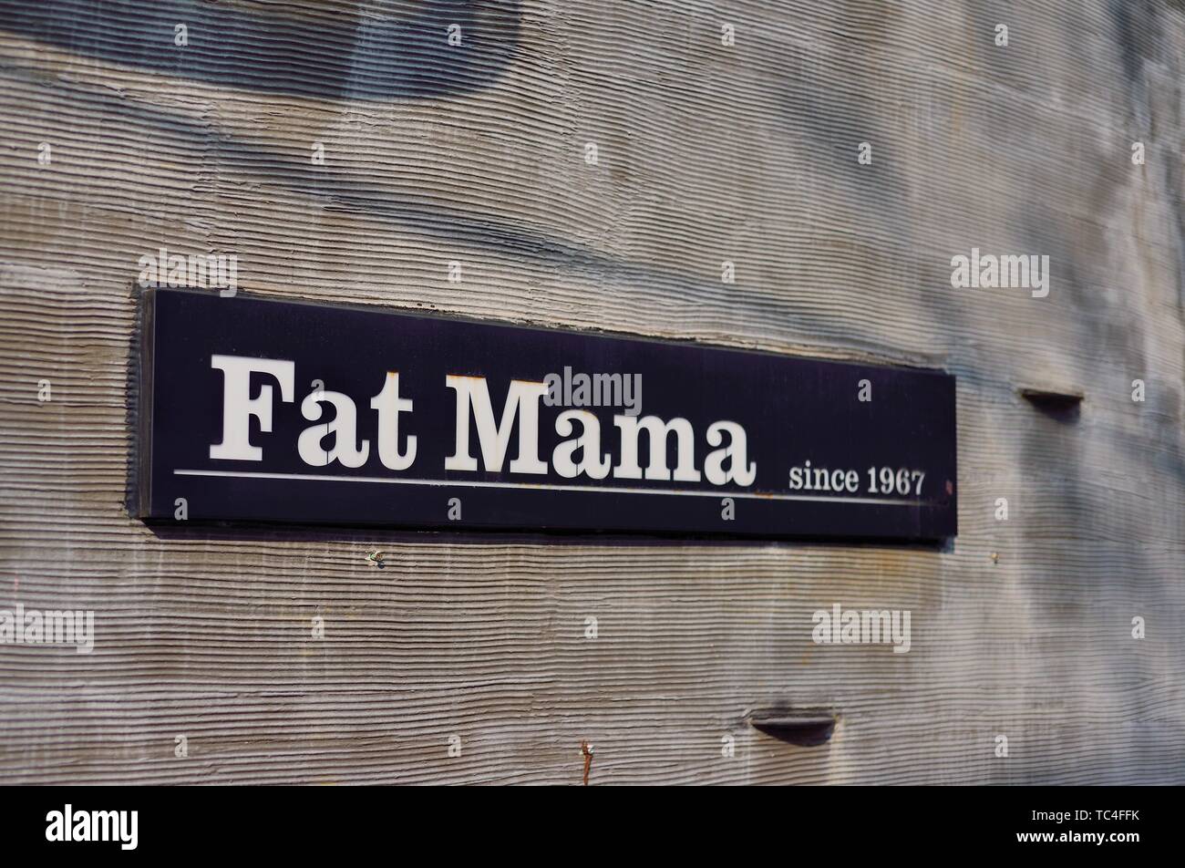 Street shop personality sign Stock Photo - Alamy
