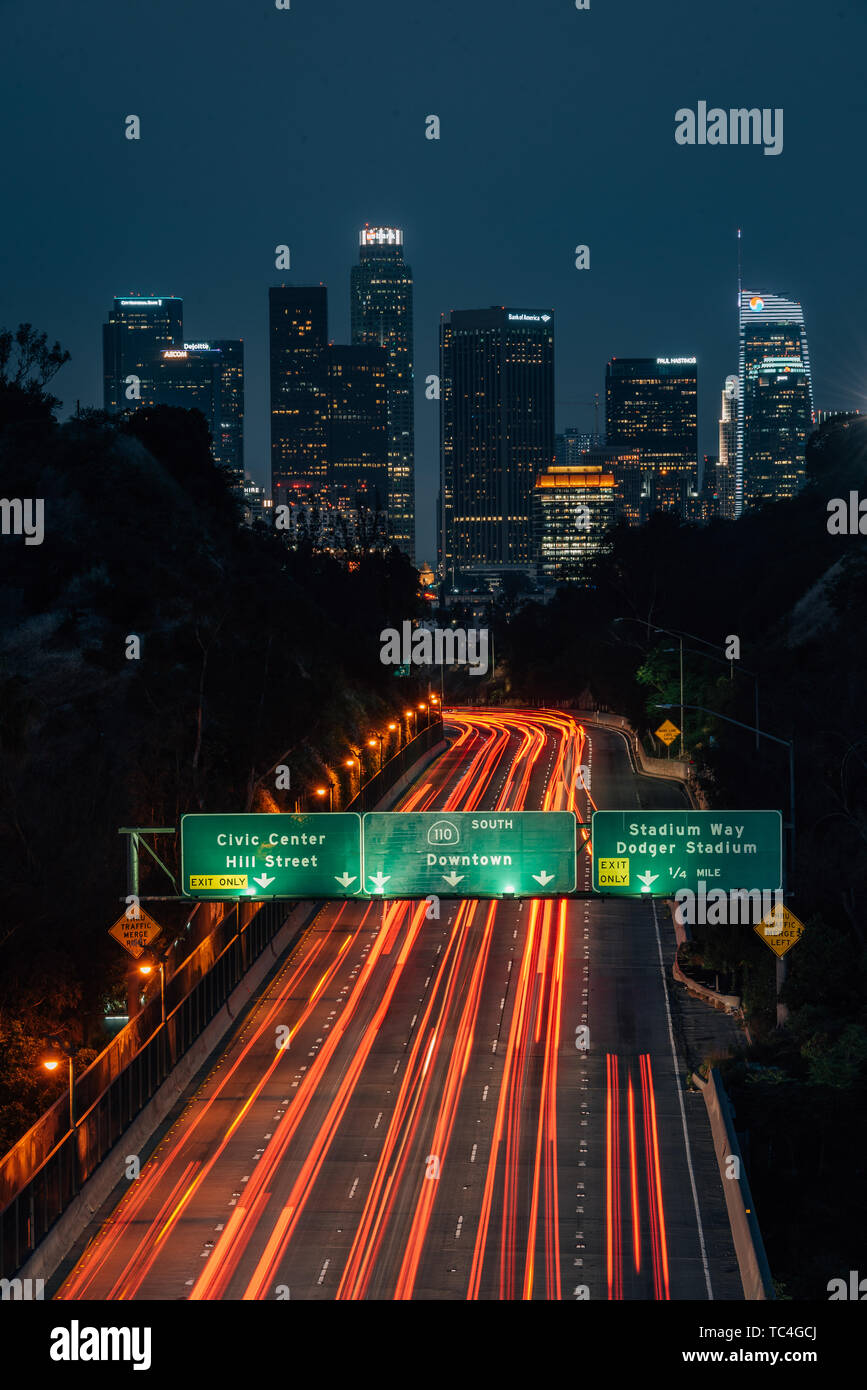 View of the downtown Los Angeles skyline and 110 Freeway at night, from ...