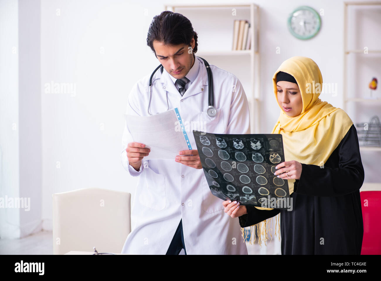 Female arab patient visiting male doctor Stock Photo - Alamy