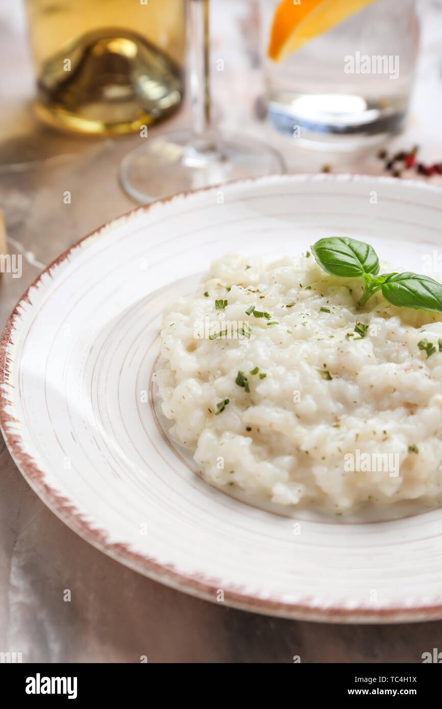 Plate with tasty risotto on table, closeup Stock Photo - Alamy