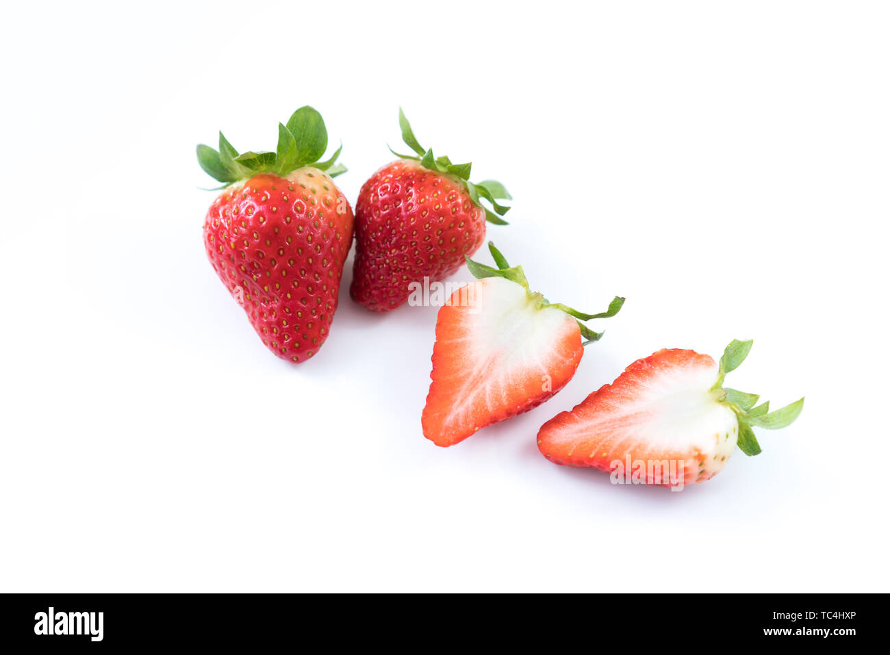 Red strawberry material under white background Stock Photo - Alamy