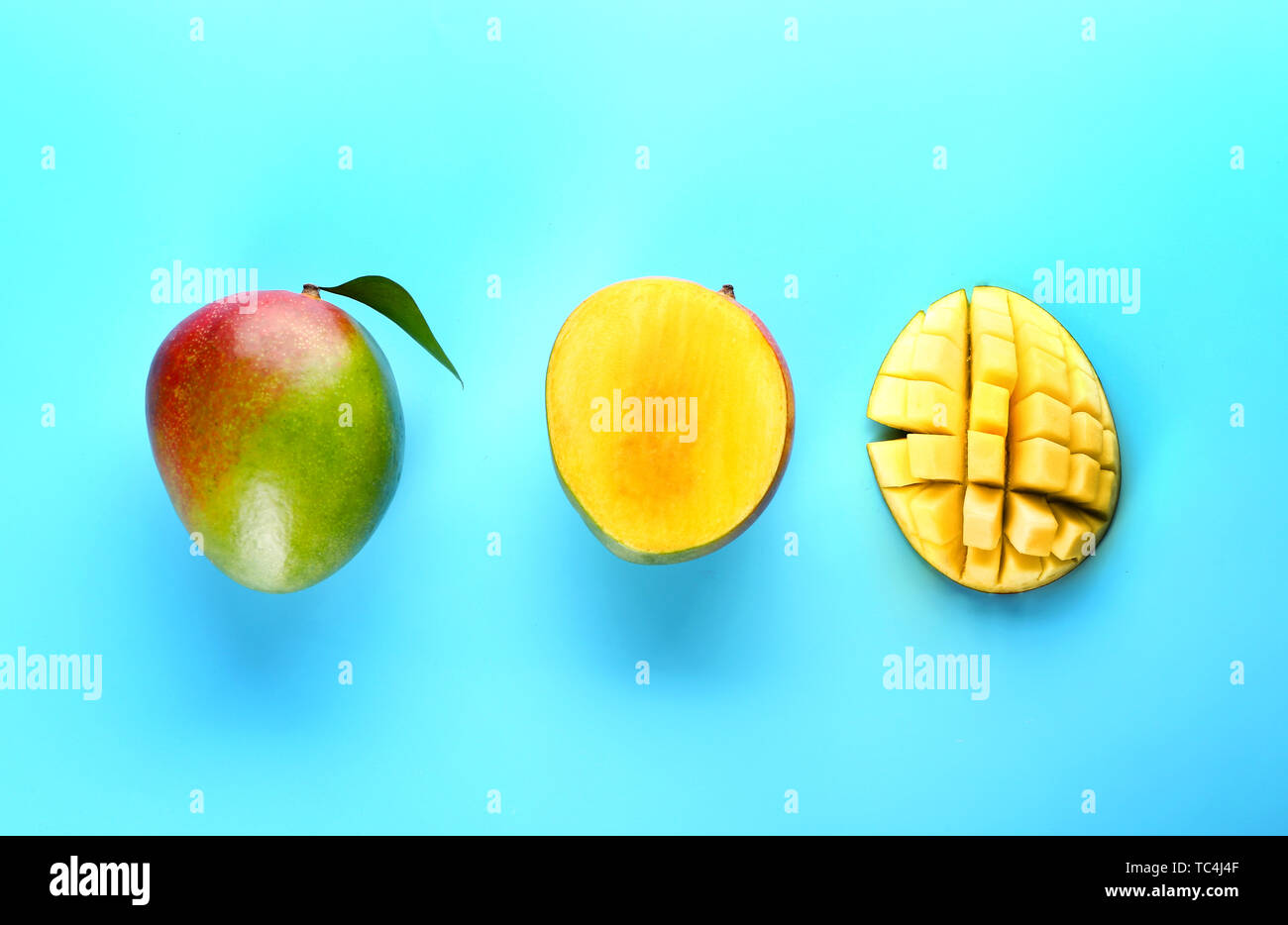 Tasty fresh mango on color background Stock Photo - Alamy