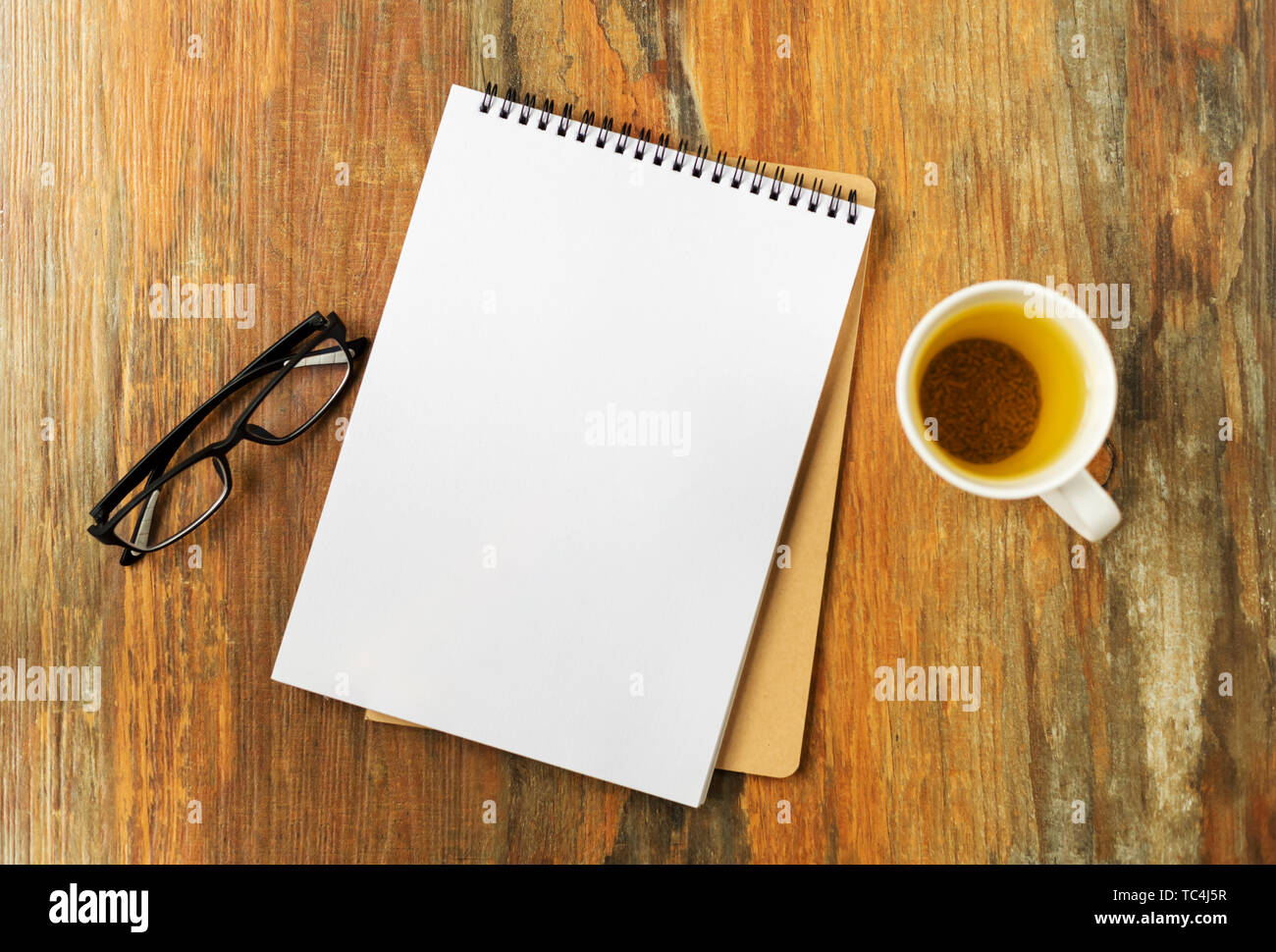 Blank notebook on your desk Stock Photo - Alamy