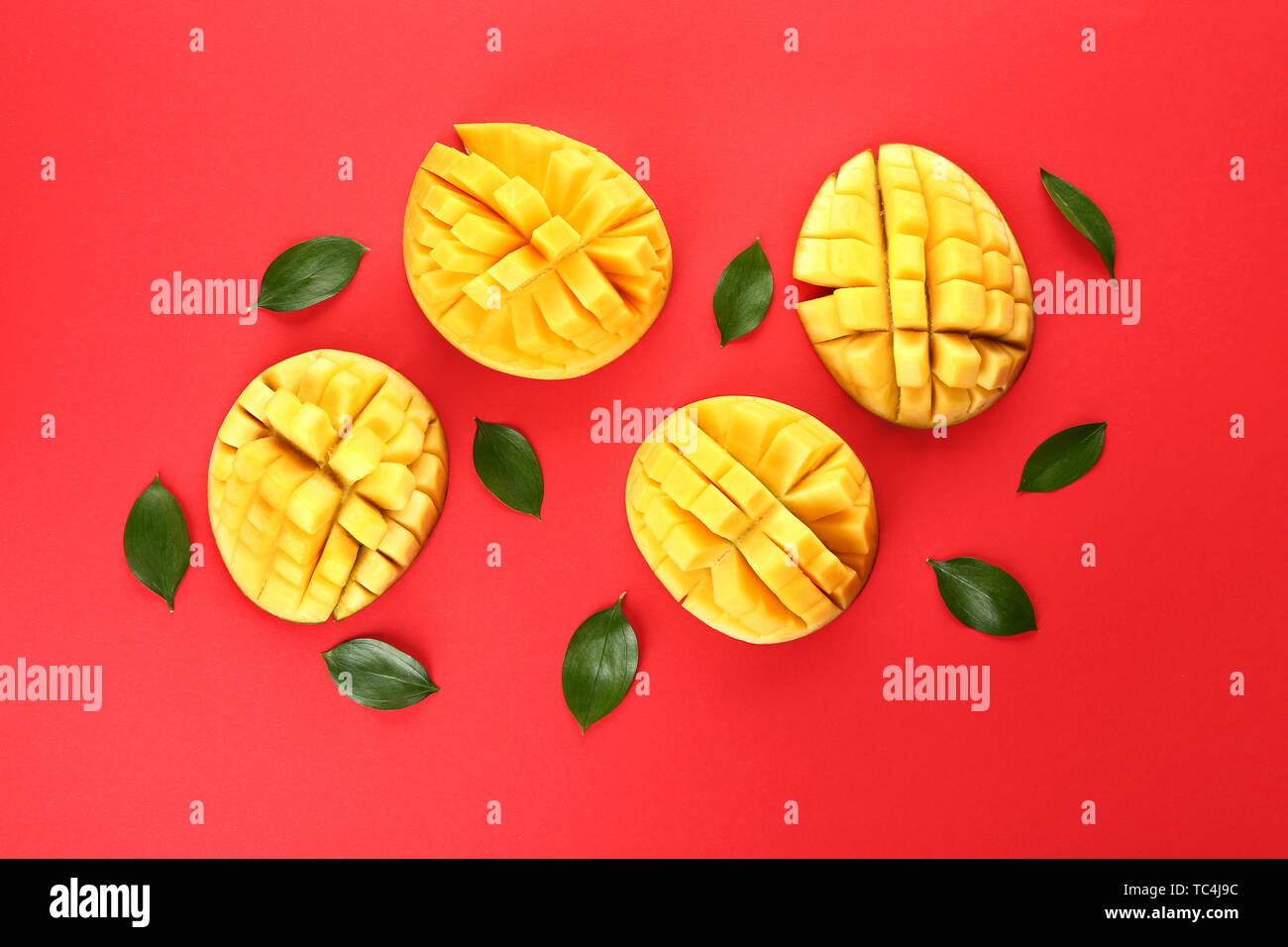 Cut fresh mango on color background Stock Photo - Alamy