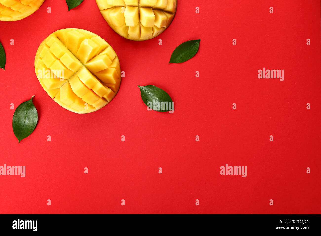 Cut fresh mango on color background Stock Photo - Alamy