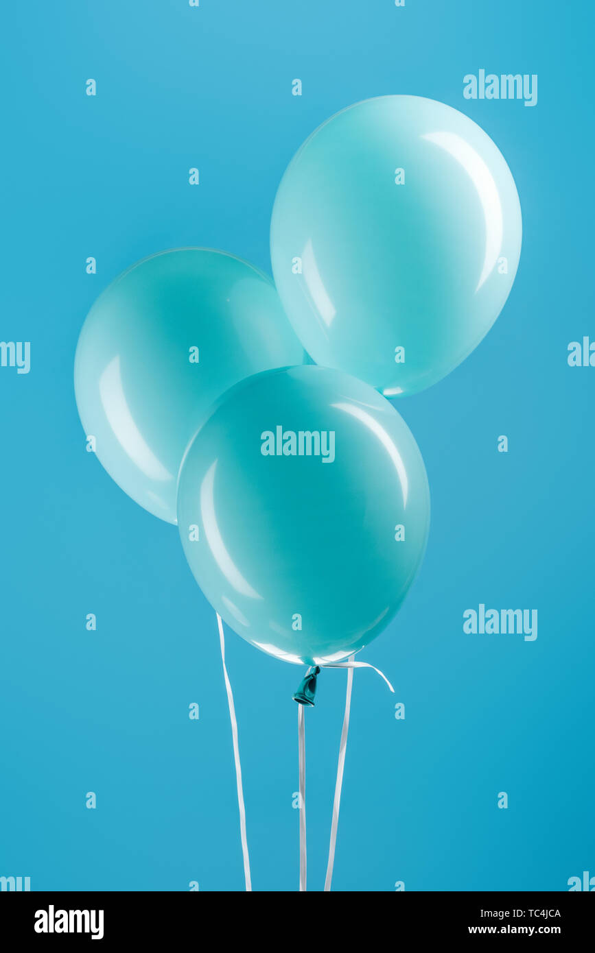 minimalistic blue decorative balloons on blue background Stock Photo ...