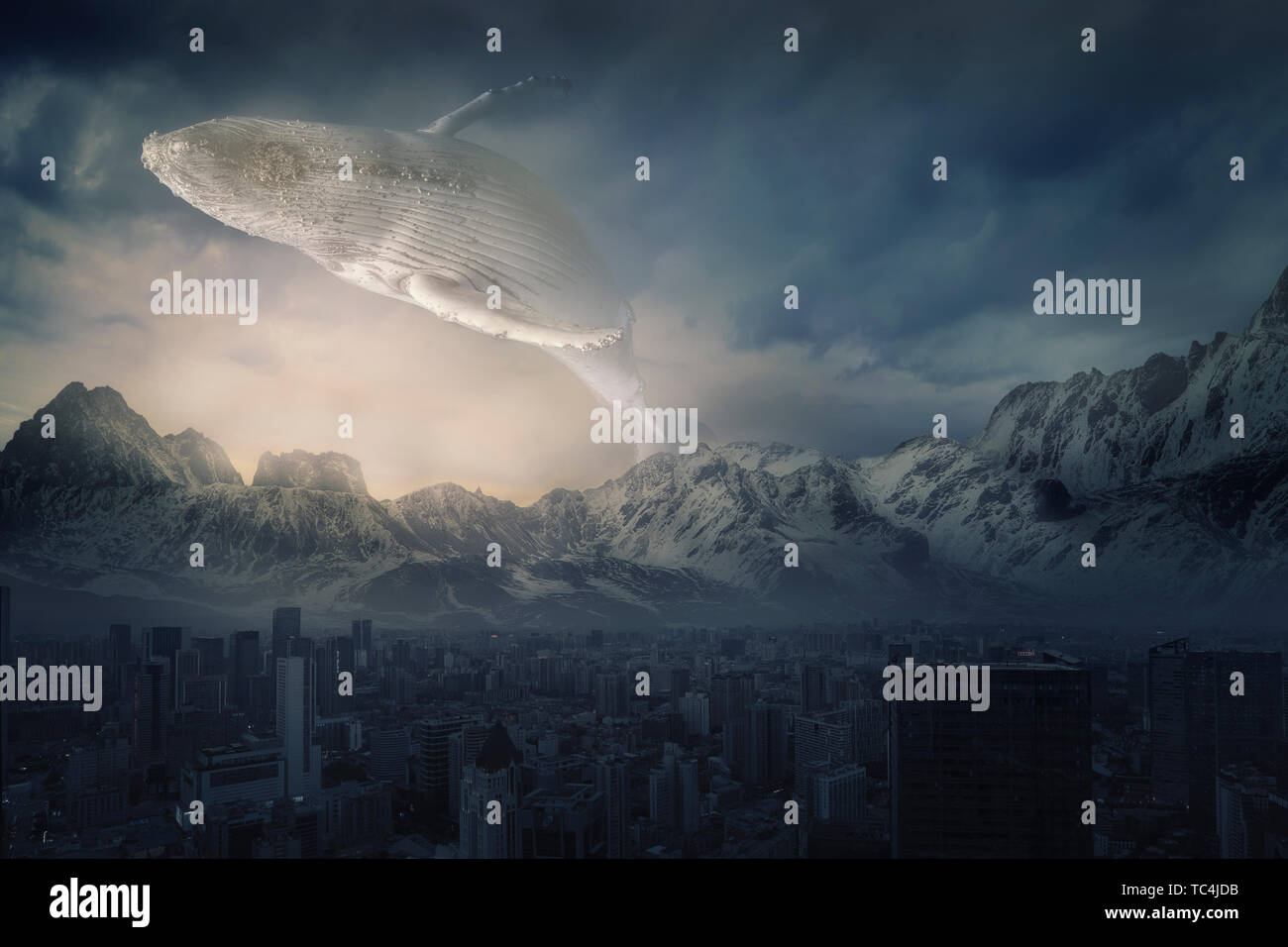 A behemoth over the city below the mountain Stock Photo - Alamy