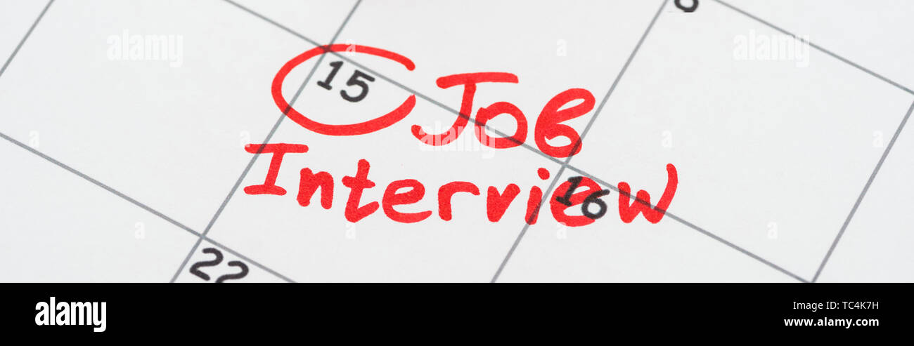 panoramic shot of print calendar with red mark and job interview ...