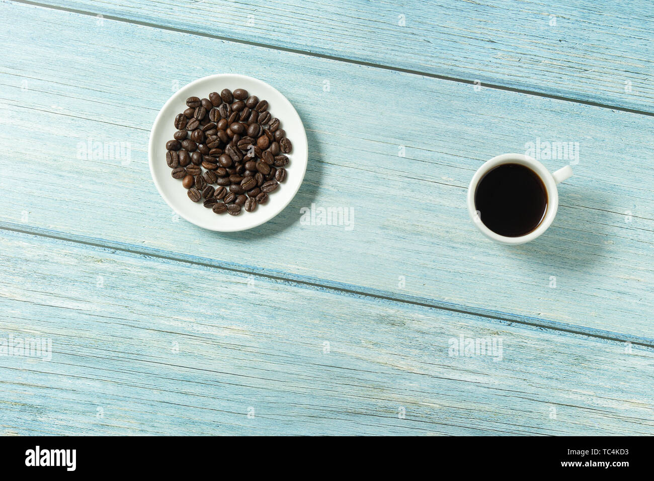 Coffee and coffee beans on a light blue background Stock Photo - Alamy
