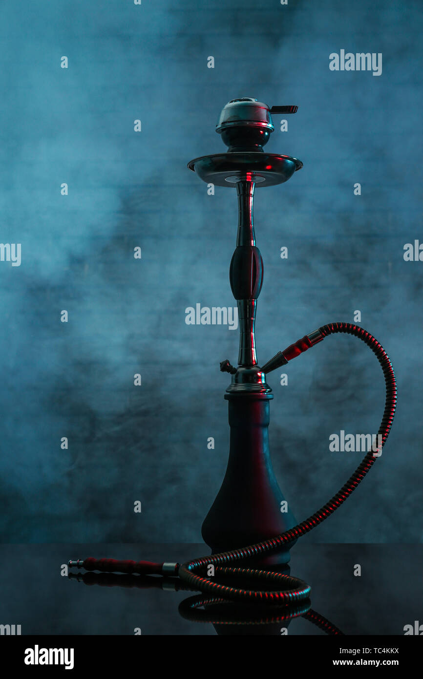 Hookah with fume on dark background Stock Photo - Alamy