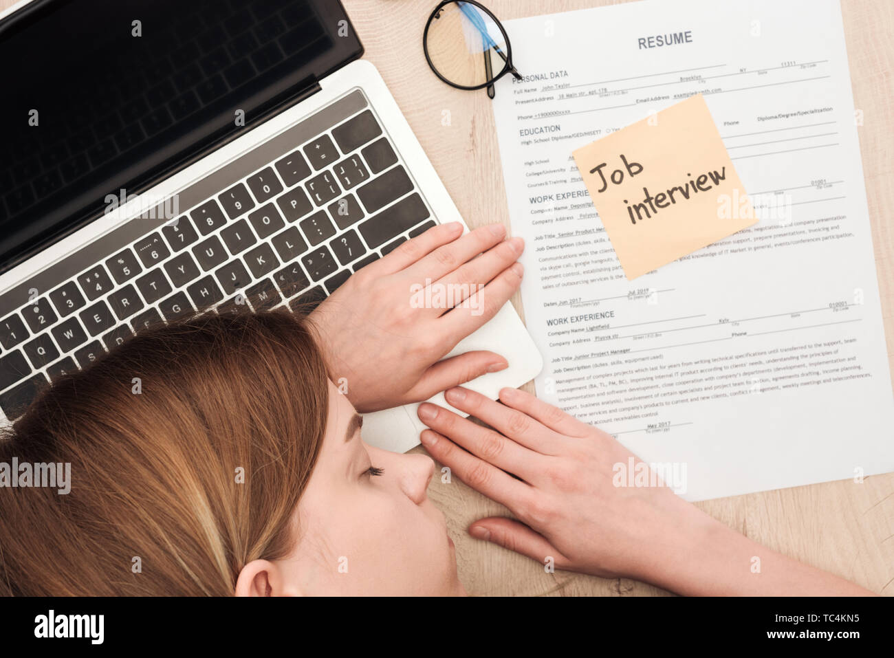 tired recruiter sleeping at workplace near resume template with sticky ...