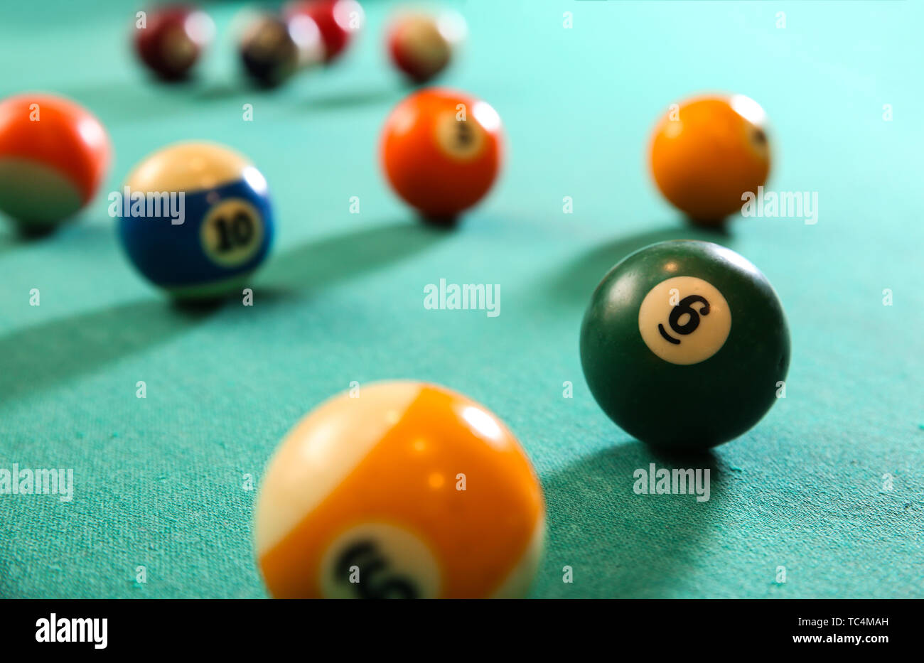 Billiard balls on table in club Stock Photo - Alamy