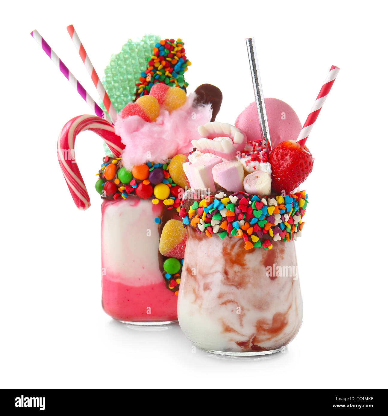 Different delicious freak shakes on white background Stock Photo - Alamy