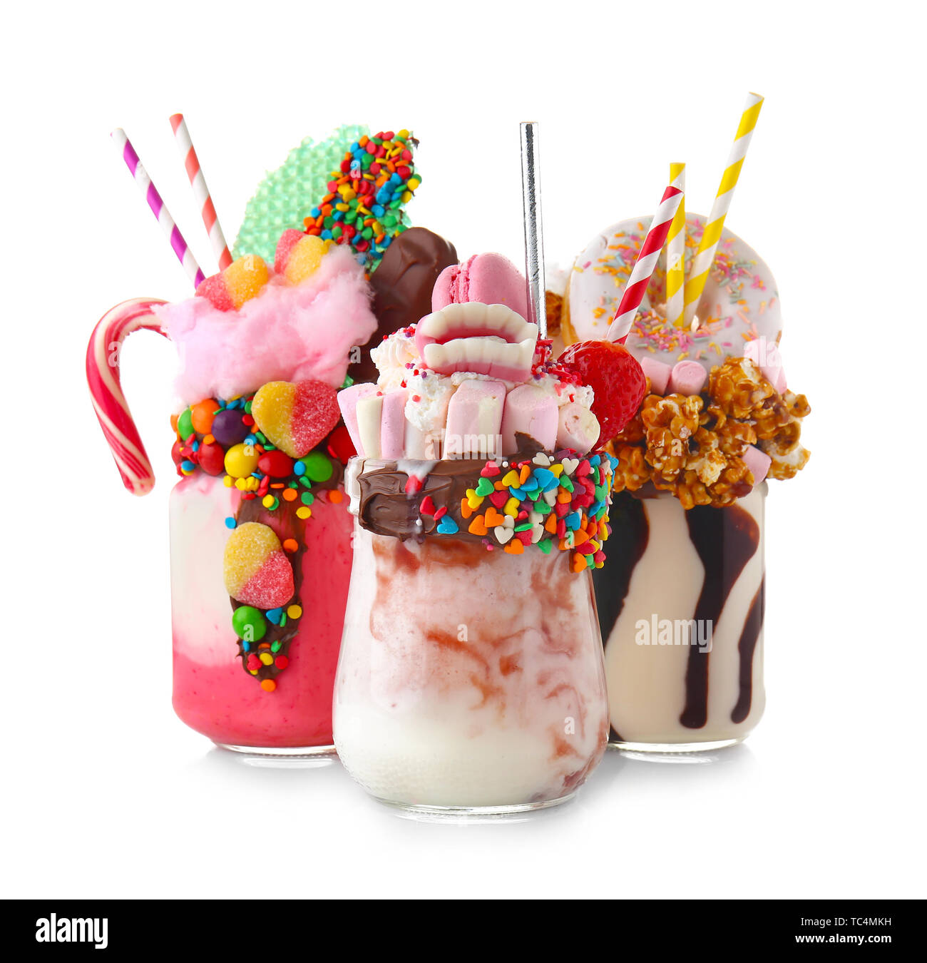 Different delicious freak shakes on white background Stock Photo - Alamy