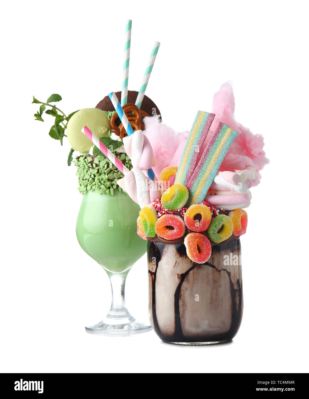 Different delicious freak shakes on white background Stock Photo - Alamy