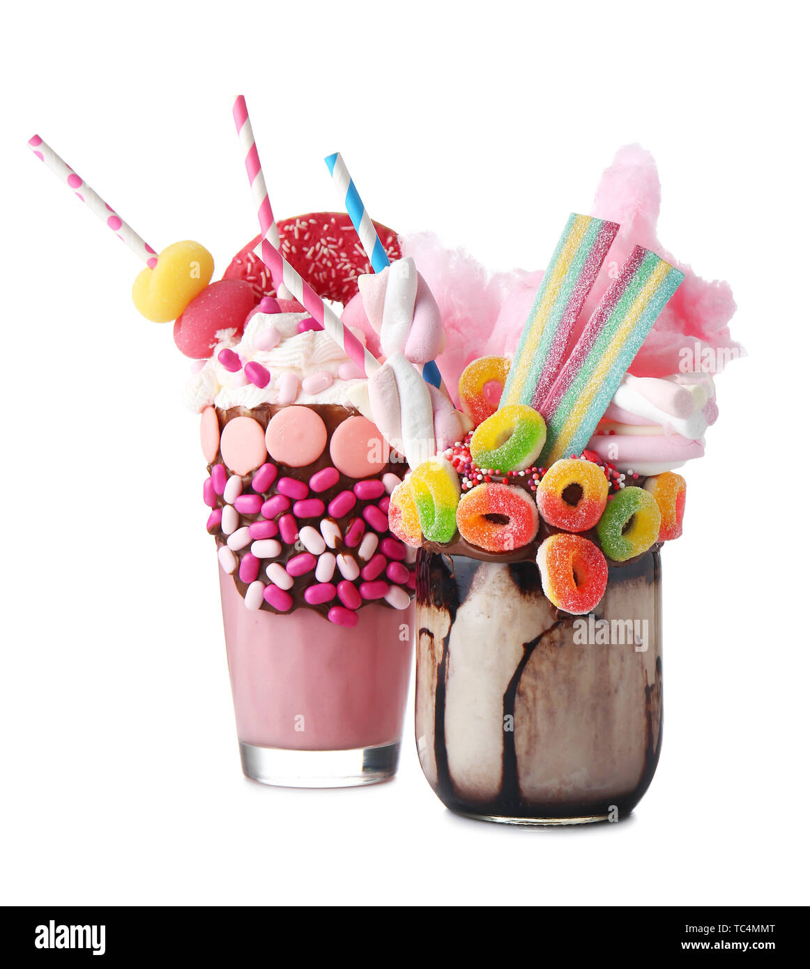 Different delicious freak shakes on white background Stock Photo - Alamy