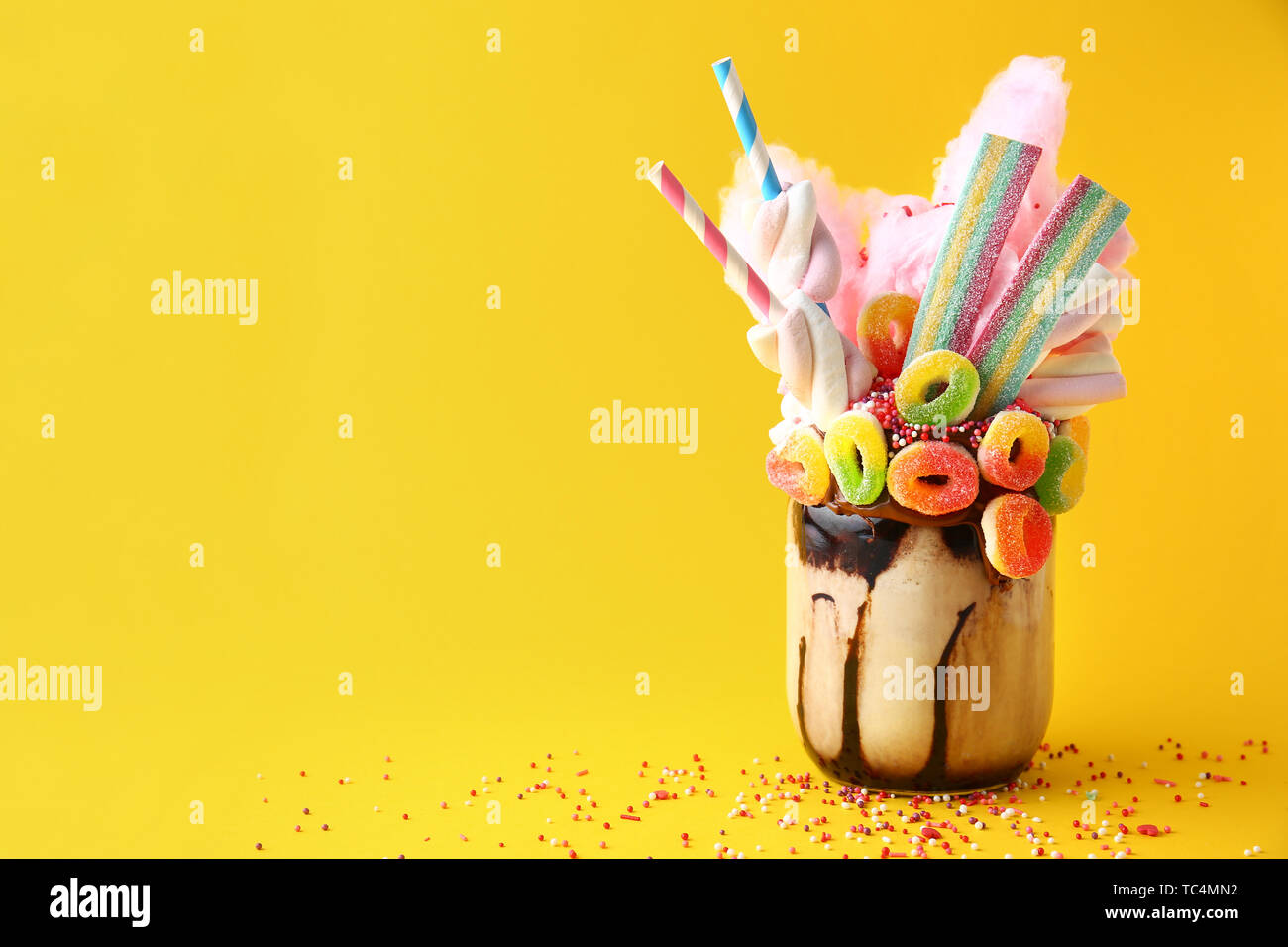 Delicious freak shake on color background Stock Photo - Alamy