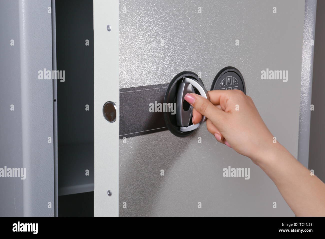 Opening locker hand hi-res stock photography and images - Alamy