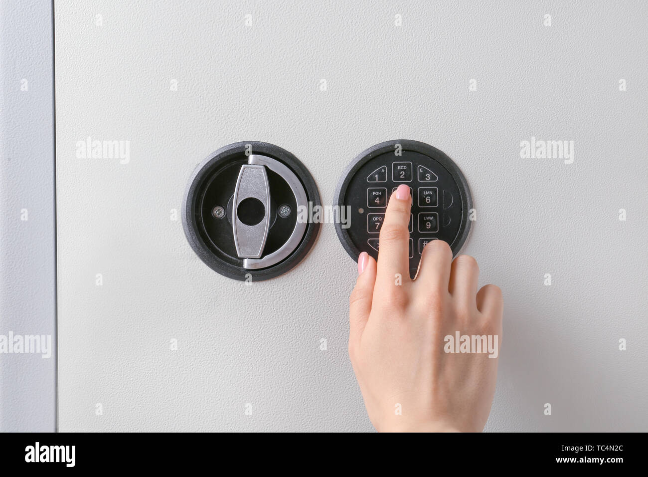 Girl opening her locker hi-res stock photography and images - Alamy