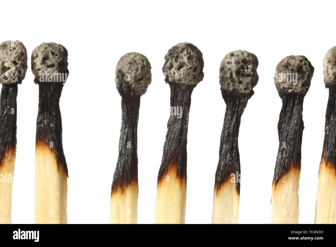 Burnt out matches on white background Stock Photo - Alamy