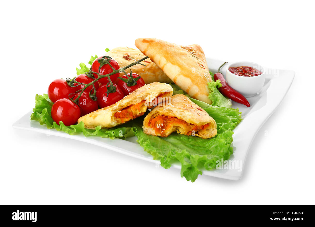 Plate with tasty vegetable samosas on white background Stock Photo - Alamy