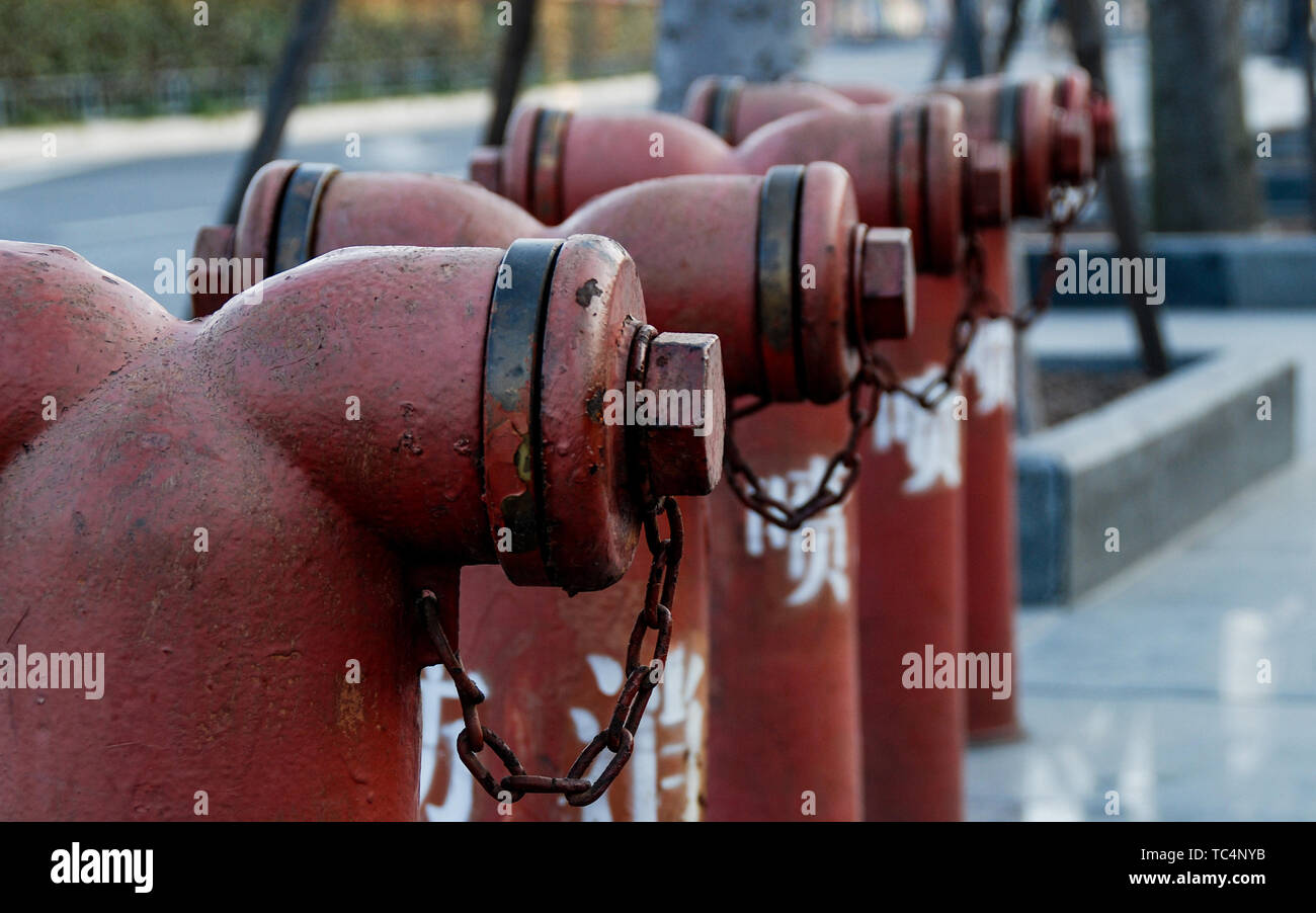 A row of fire hydrants Stock Photo - Alamy