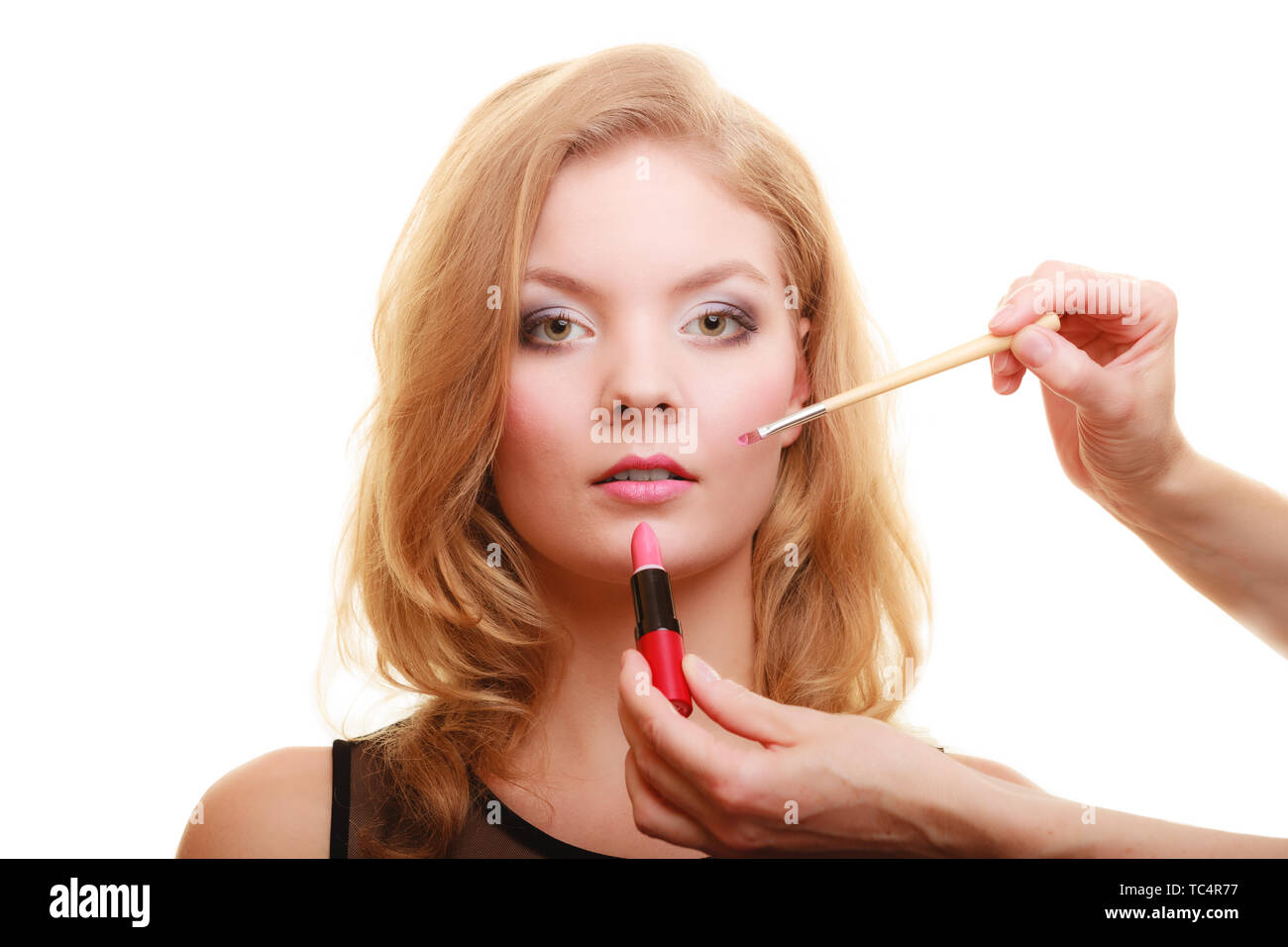 Cosmetic beauty procedures and makeover concept. Makeup artist applying ...