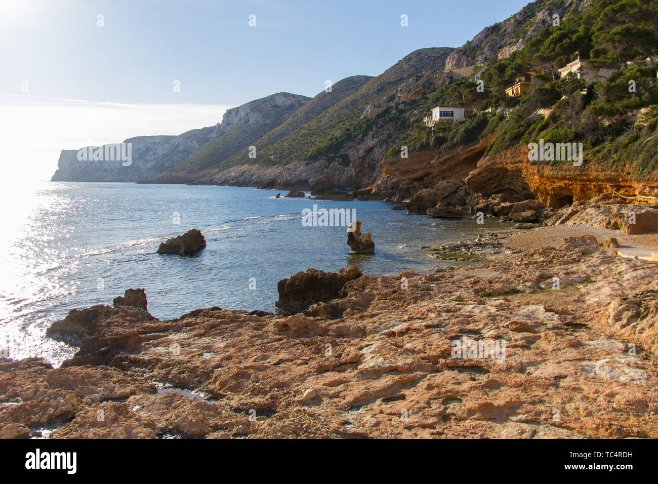 Las Rotas rocky beach in Denia, Spain at sunset Stock Photo - Alamy