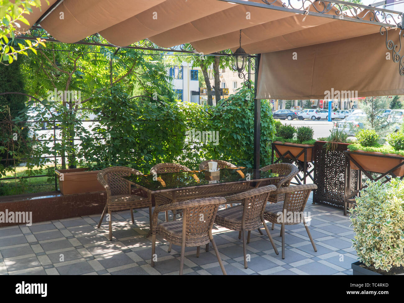 outdoor summer cafe with flower beds Stock Photo - Alamy