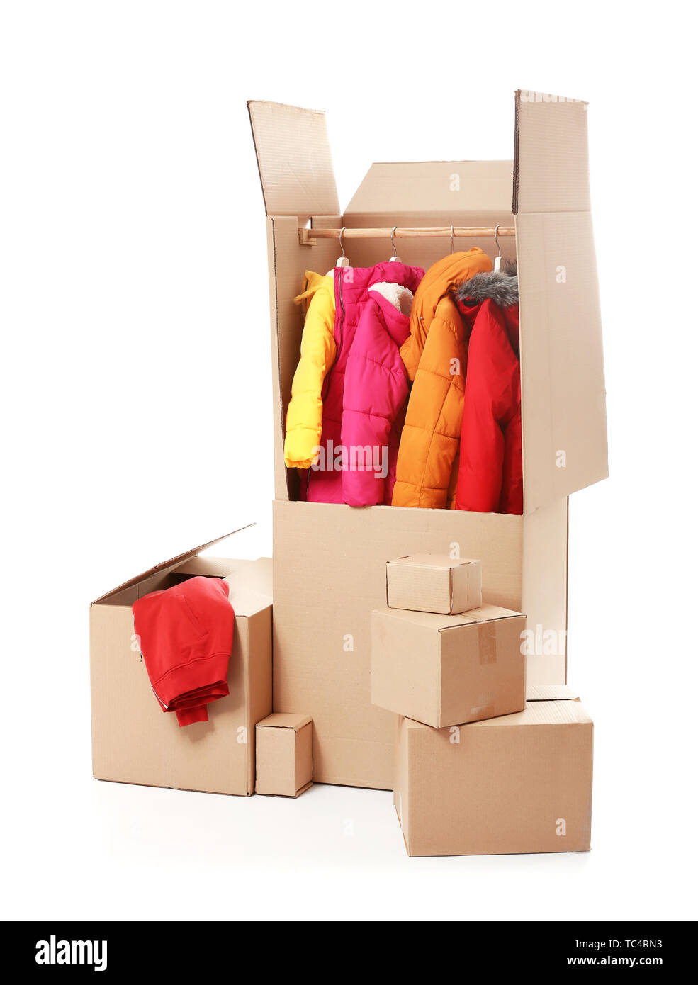 Wardrobe boxes with clothes on white background Stock Photo - Alamy