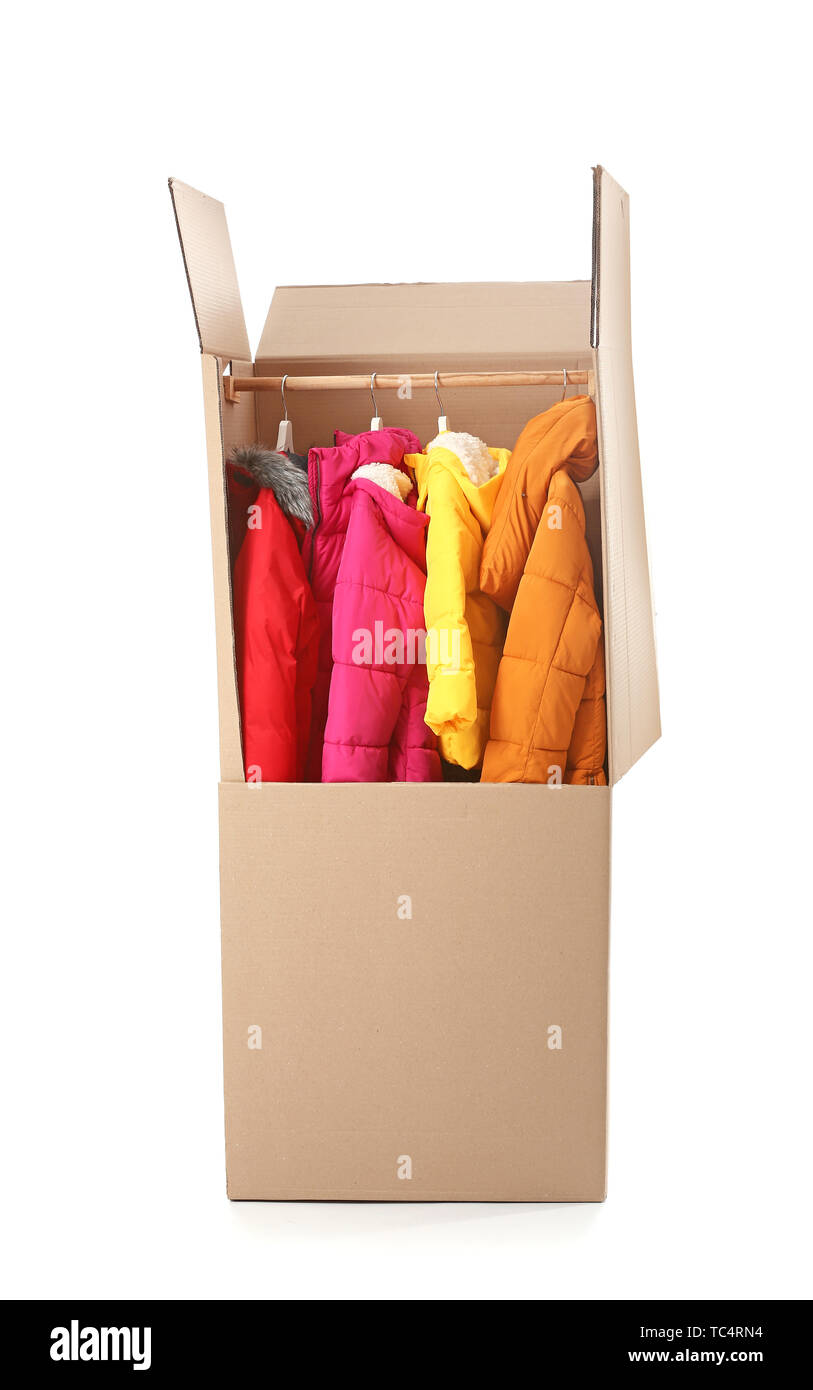 Wardrobe box with clothes on white background Stock Photo - Alamy