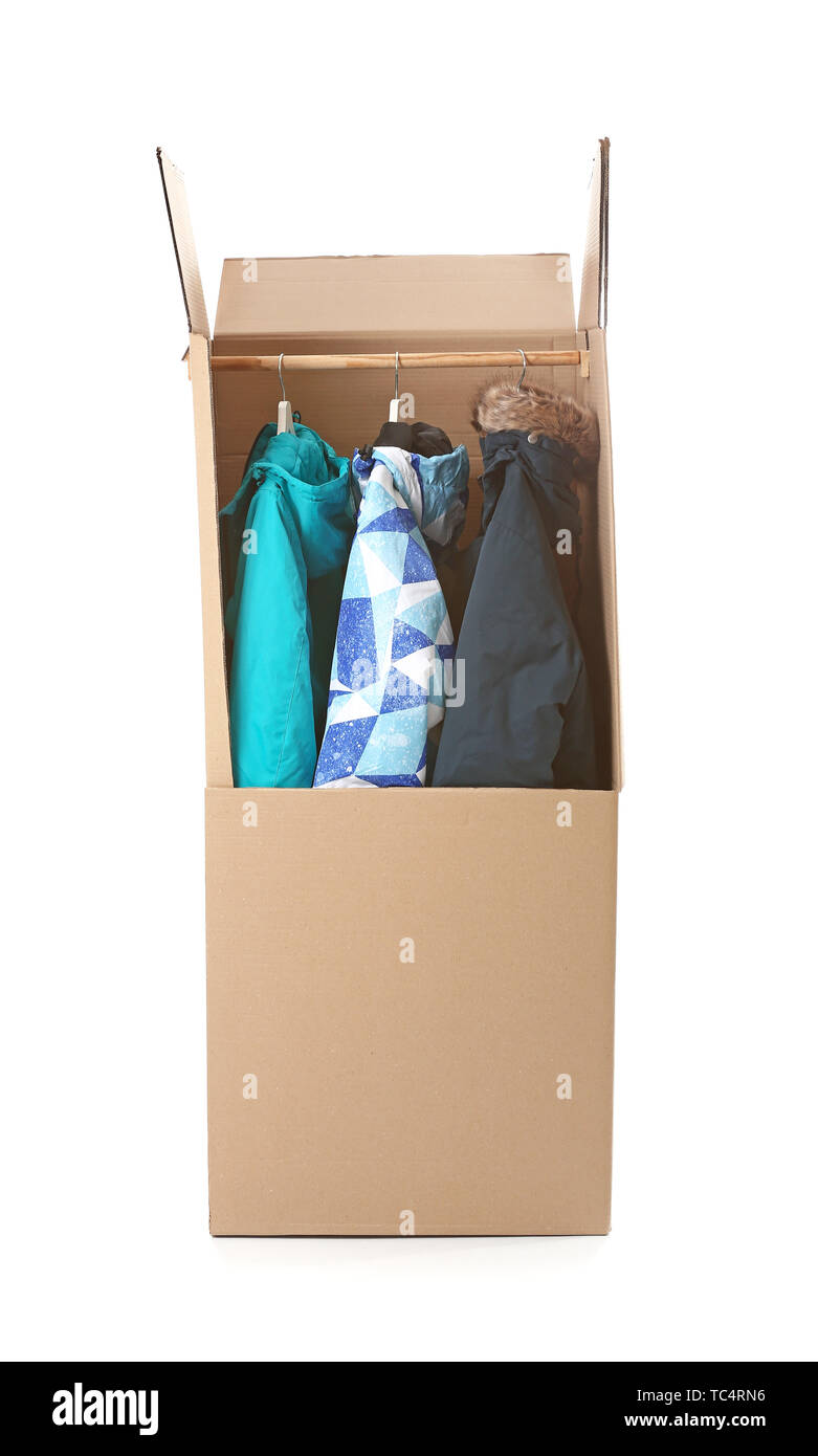 Wardrobe box with clothes on white background Stock Photo - Alamy