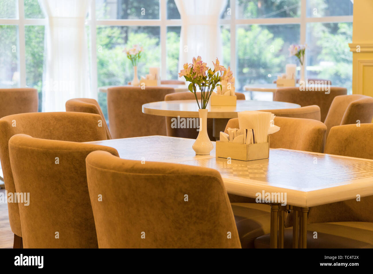 modern restaurant interior with windows and flowers. cafe room ...