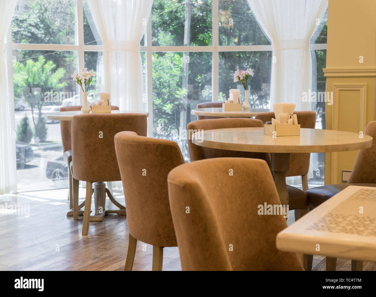 modern restaurant interior with windows and flowers. cafe room ...