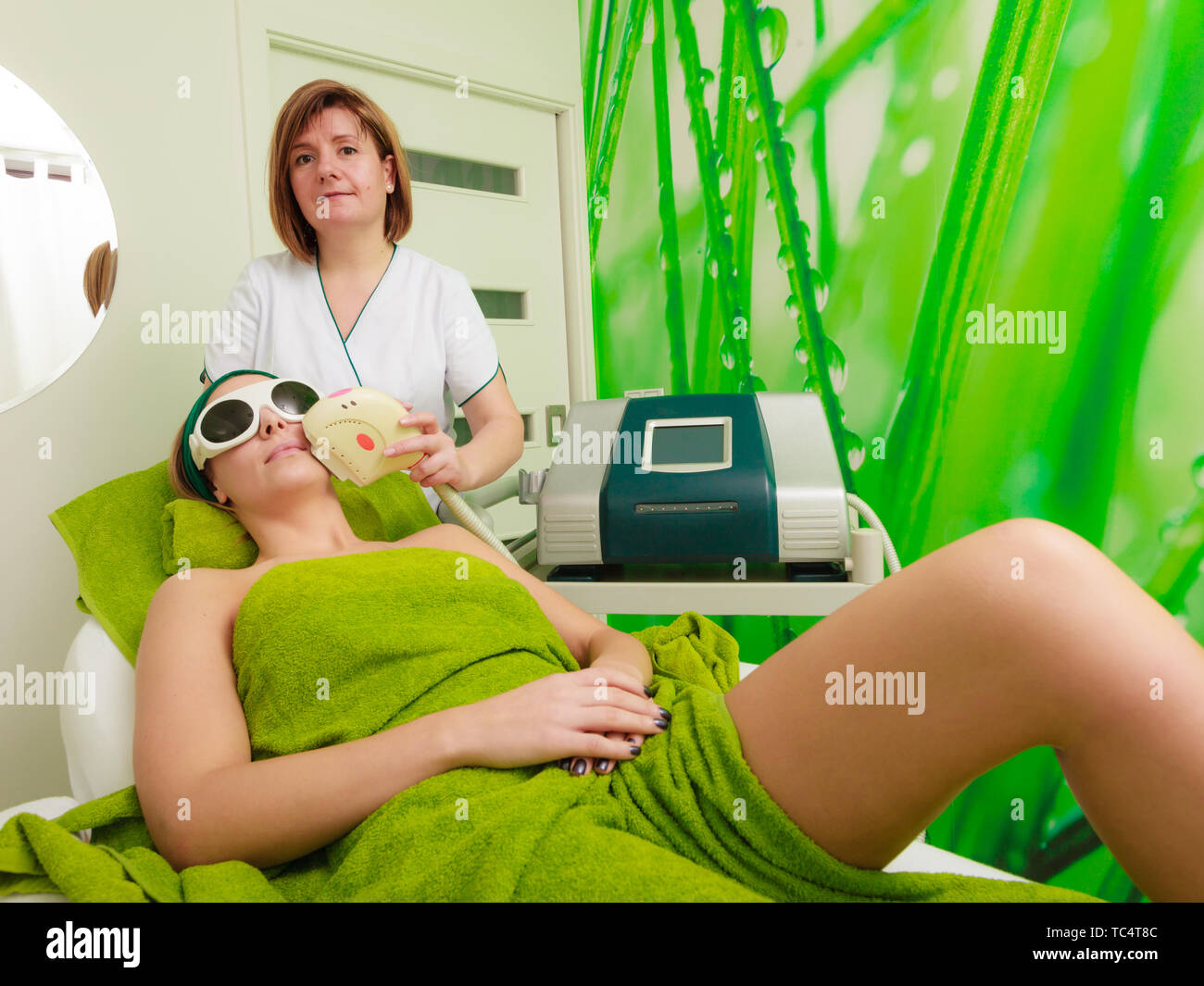 Medical cosmetology, modern cosmetic devices concept. Woman wearing ...