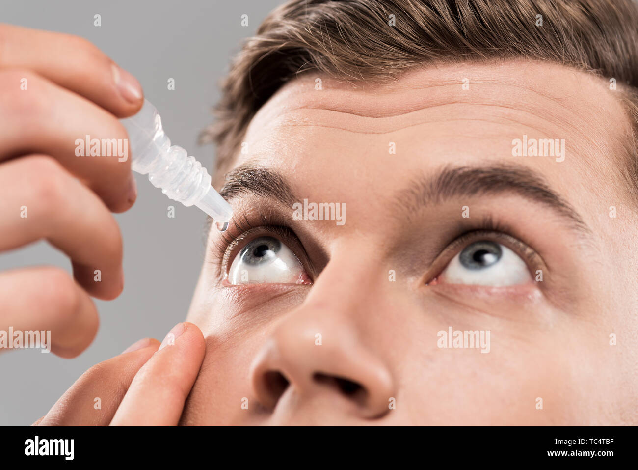 Applying eye drops hi-res stock photography and images - Alamy