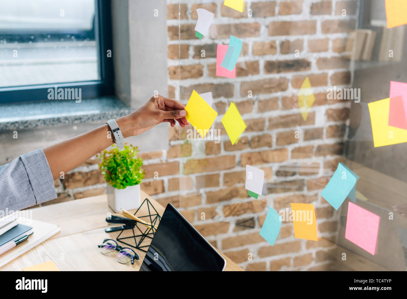 Woman putting sticky notes on hi-res stock photography and images - Alamy
