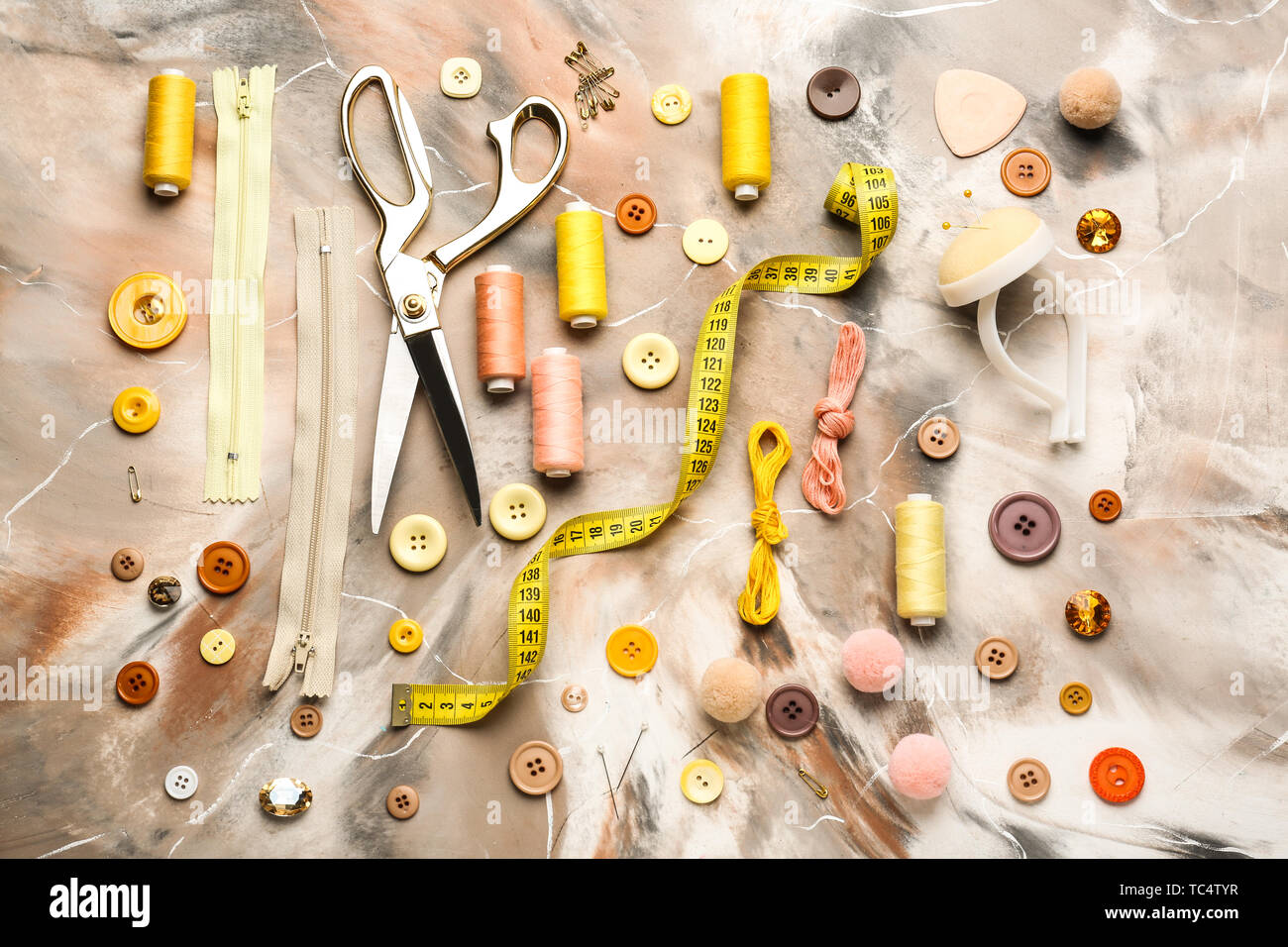 Set of sewing threads and accessories on marble background Stock Photo ...