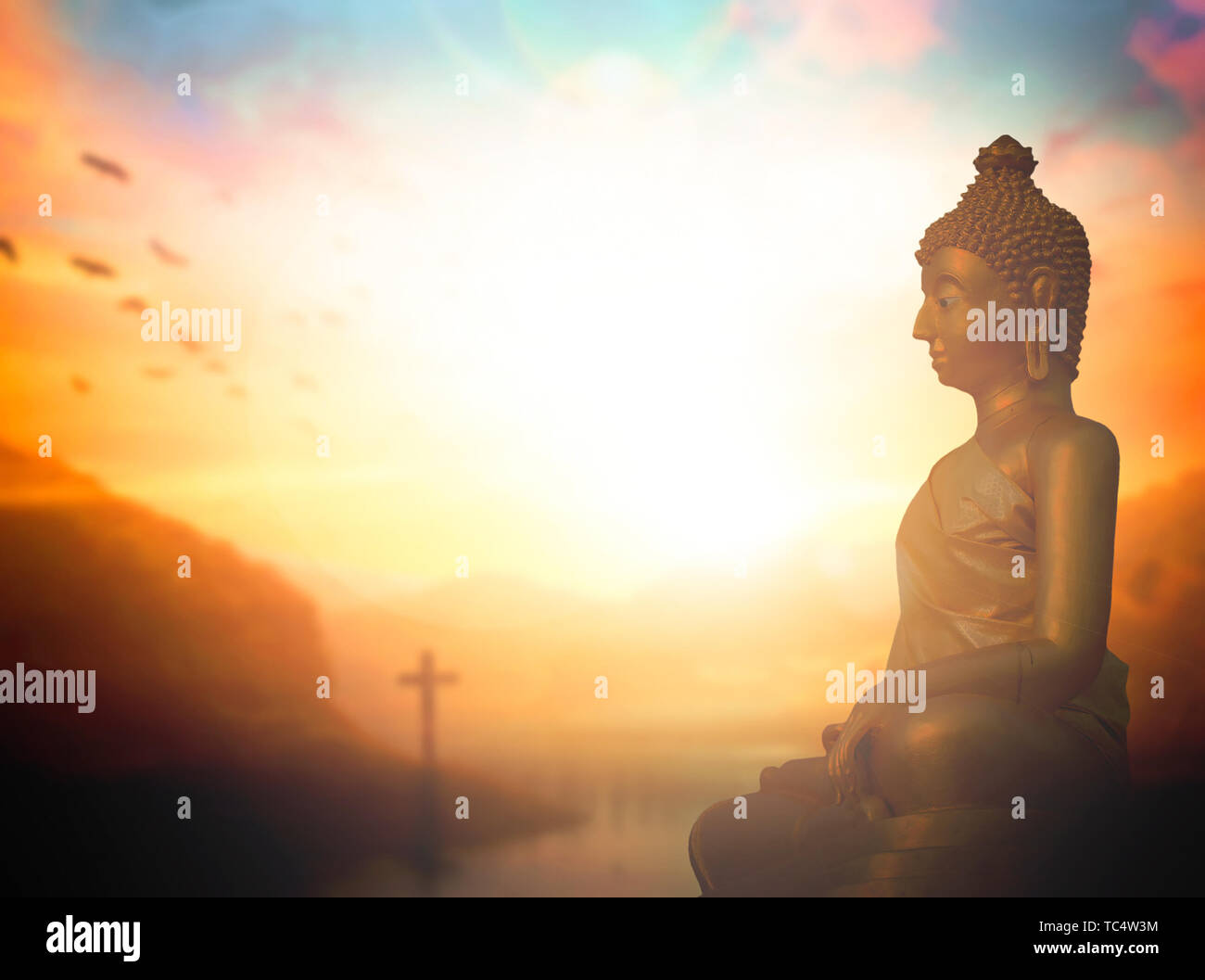 Religious peace concept: a Buddha statue on a sunset background of the ...