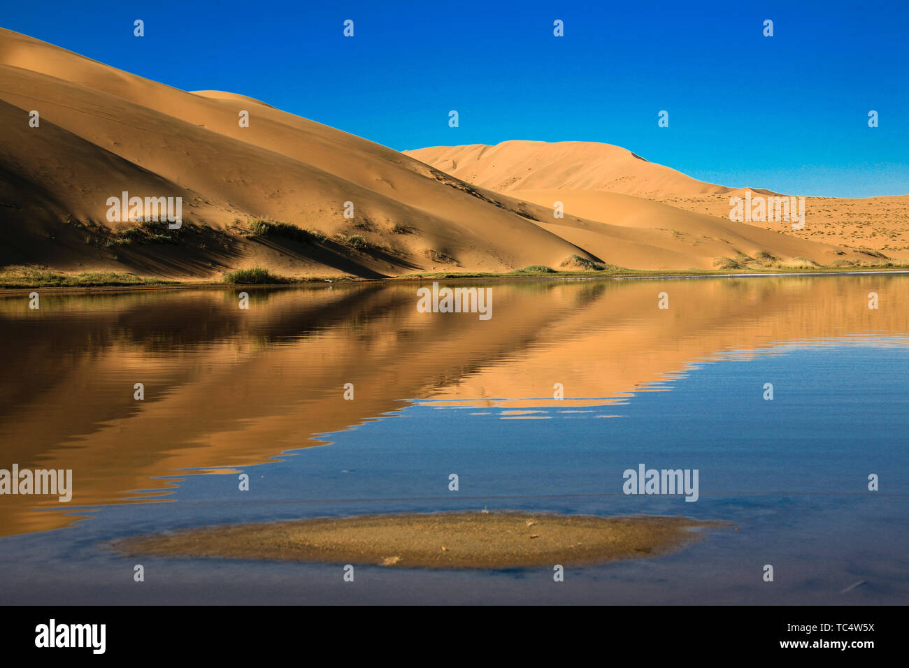 Desert sand mountain lake water reflection Stock Photo - Alamy