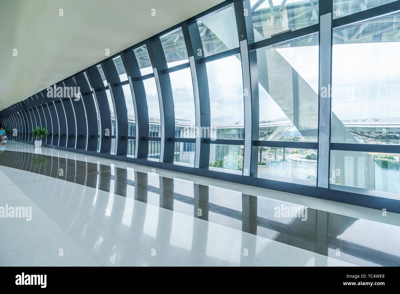 corridor with many glass windows in modern shopping mall Stock Photo ...