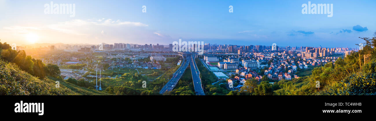 skyline and cityscape of city at foot of hill at sunrise time Stock ...