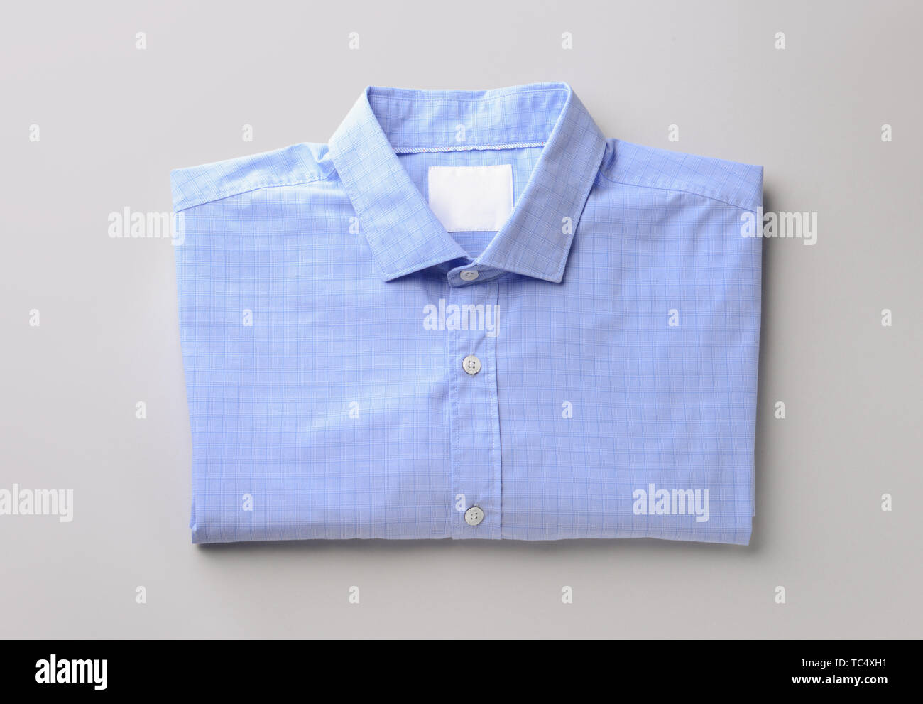 Shirt after dry-cleaning on light background Stock Photo - Alamy