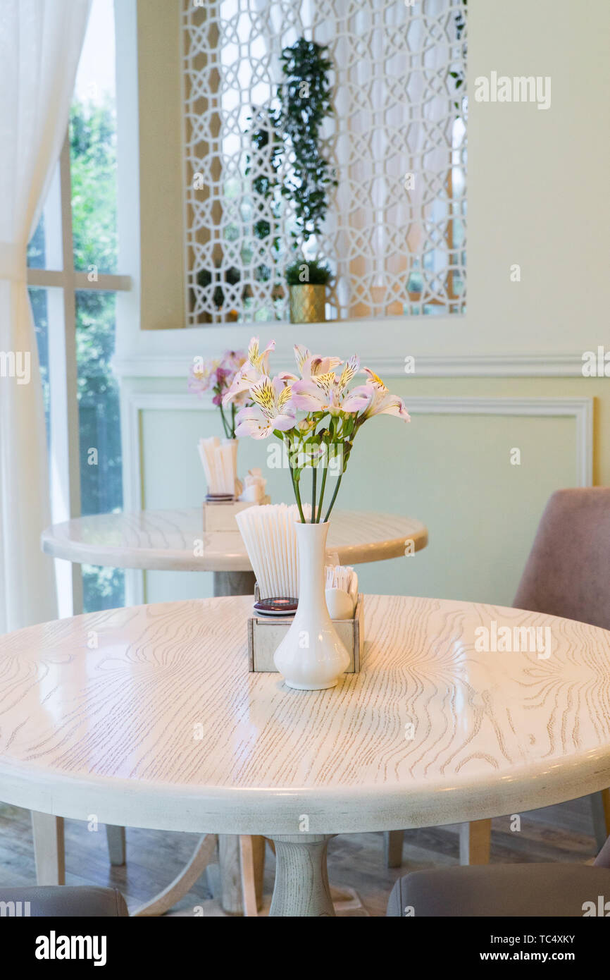 modern restaurant interior with windows and flowers. cafe room ...